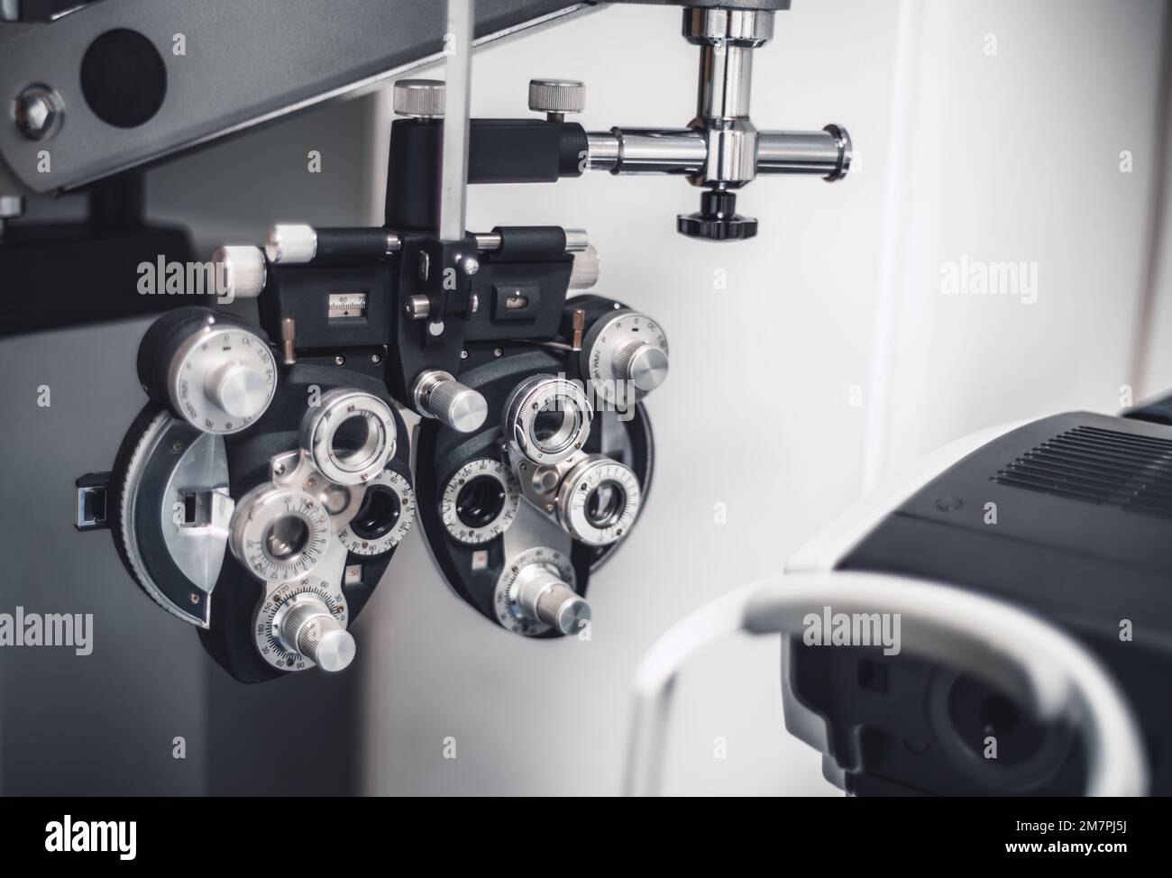 A capture of a black-colored phoropter, an ophthalmic testing device ...