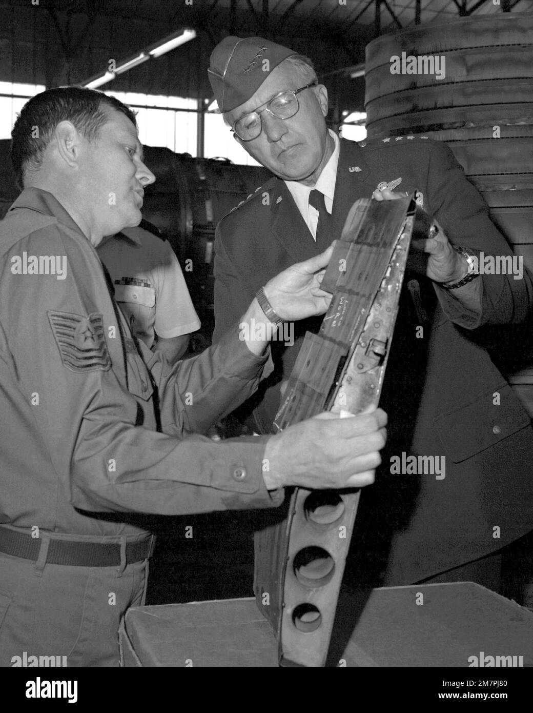 A master sergeant briefs GEN Bryce Poe, commander, Air Force Logistics ...