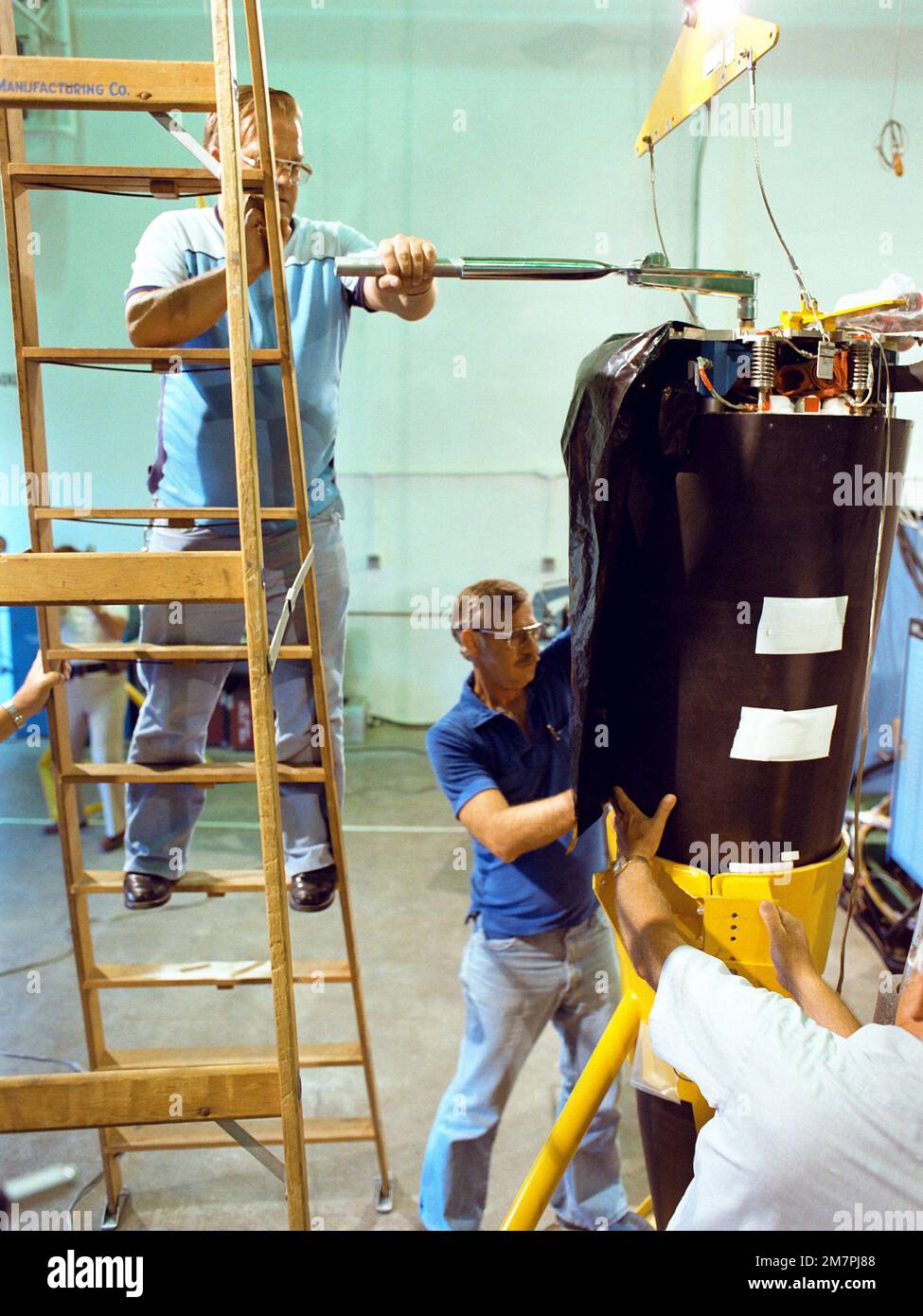 Technicians put a control section and a frustum of an advanced ...