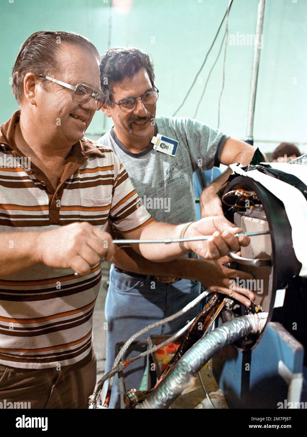 Technicians install the Dormant Inertial Navigation System (DINS) in ...