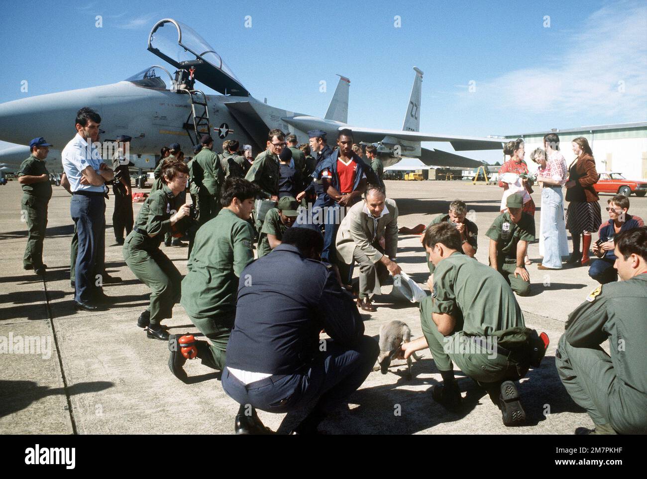 United States Air Force and RAAF personnel watch a baby kangaroo during ...