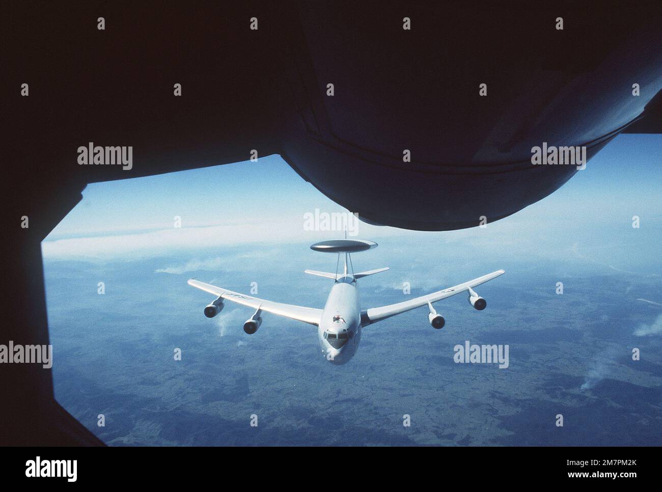 In-flight view of an E-3A Airborne Warning and Control System aircraft, seen from a KC-135 ...