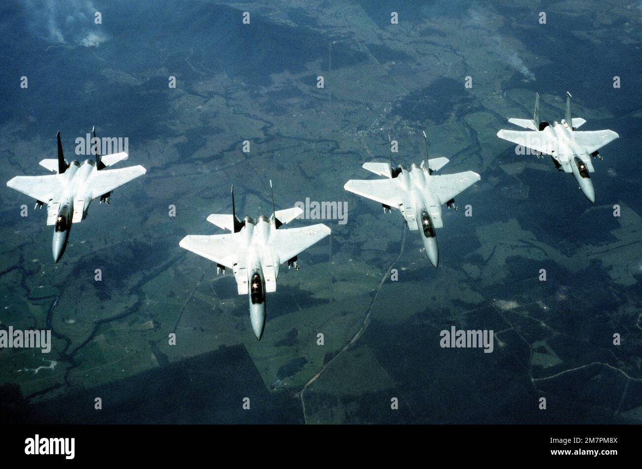 A front view of a four-ship formation of F-15 Eagle aircraft carrying ...