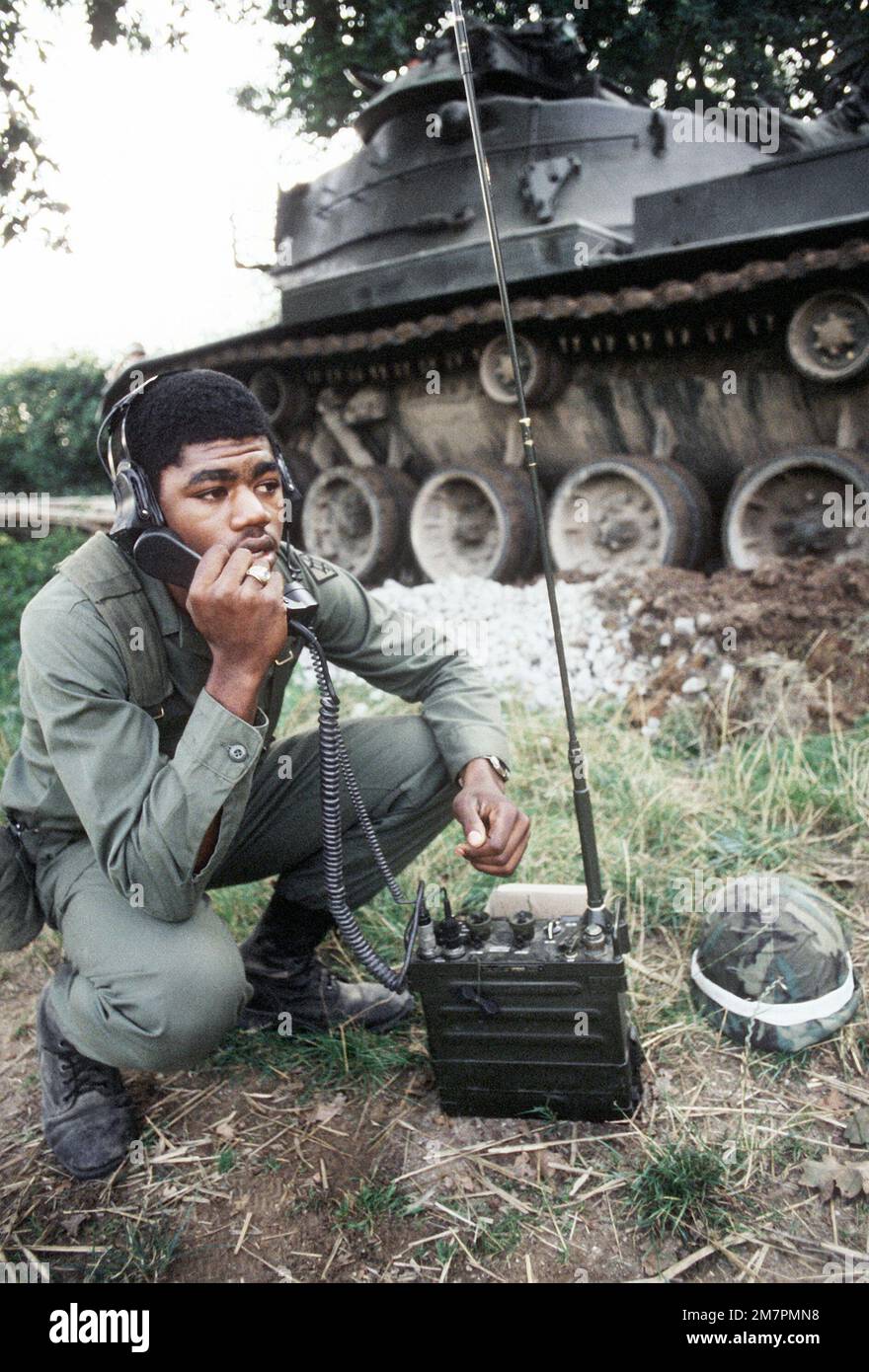 An Army gunner of the Armor Group makes radio contact during the ...