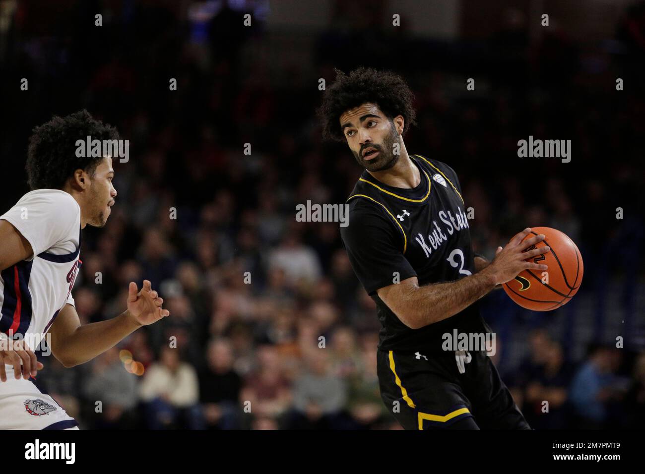 Kent State guard Sincere Carry, right, controls the ball while defended ...