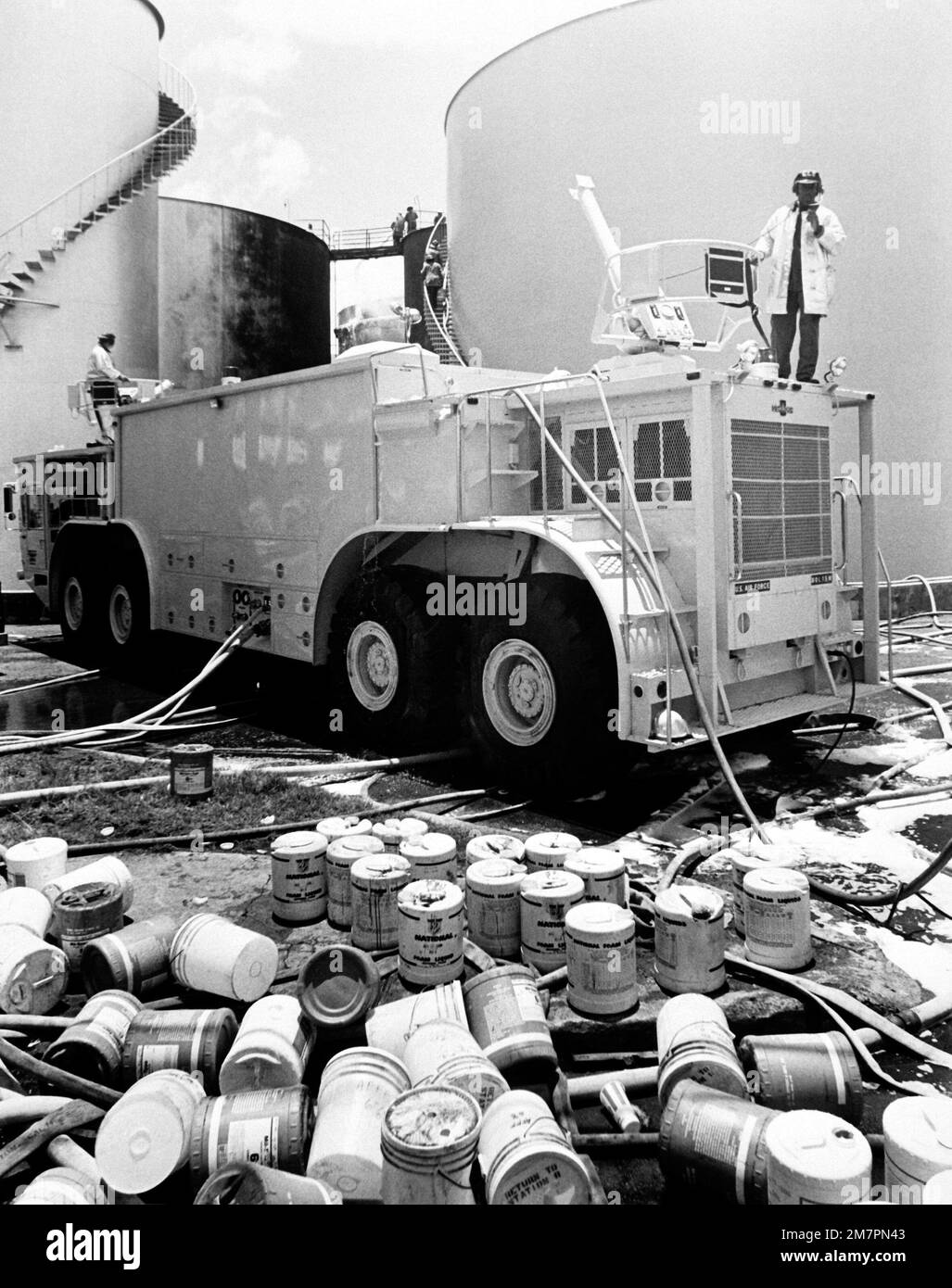 A view of a P-15 fire engine at a fuel storage fire scene. Hickam Air ...