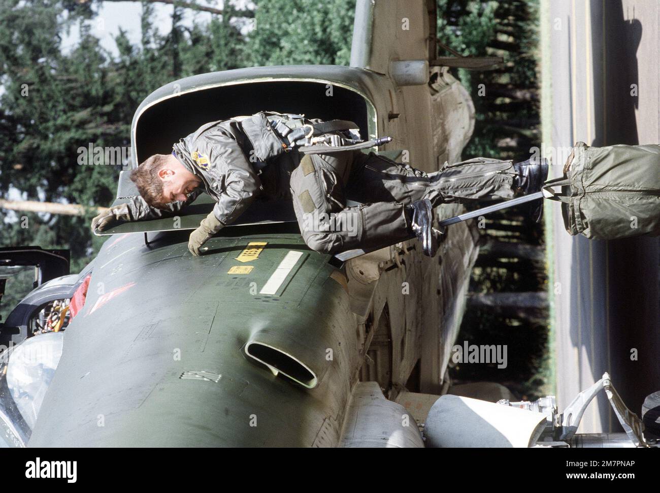 AN F-4E Phantom II pilot of the 4th Tactical Fighter Wing climbs into ...