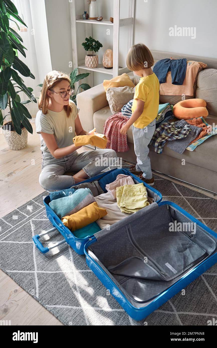 Kid Packing Suitcase