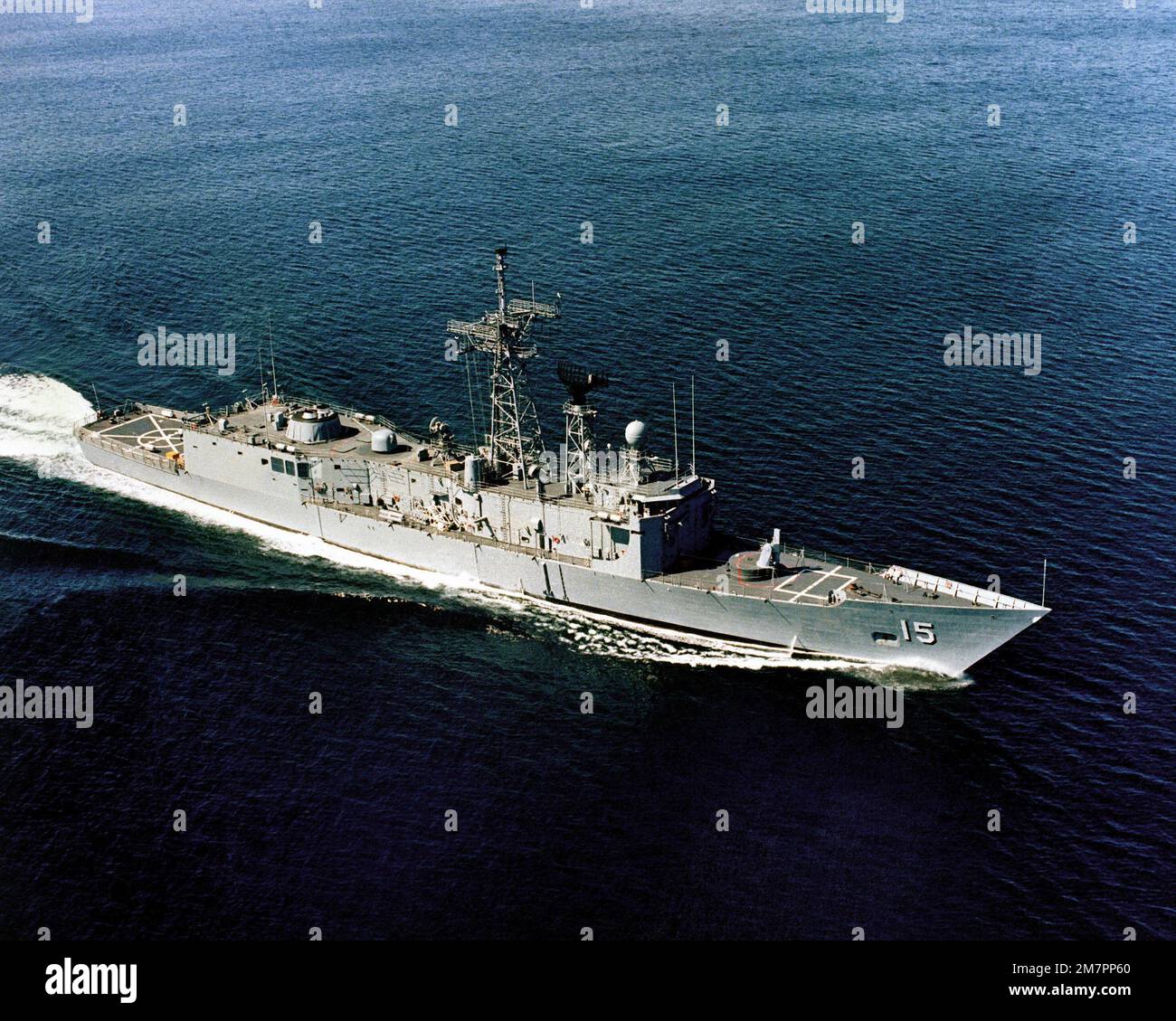 An aerial starboard bow view of the guided missile frigate USS ESTOCIN ...