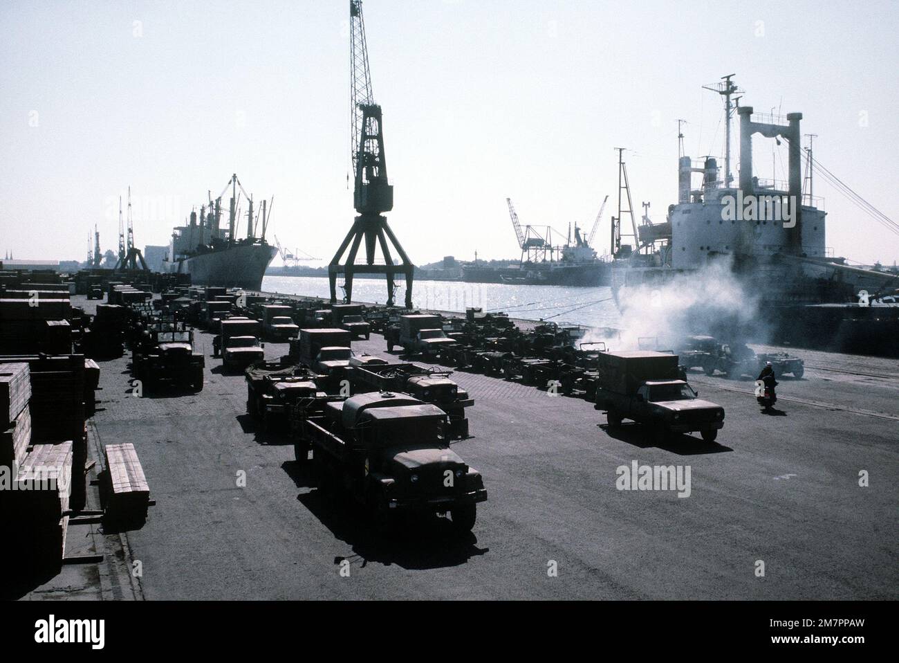 Overall view of a convoy of Army vehicles on the pier, after being ...