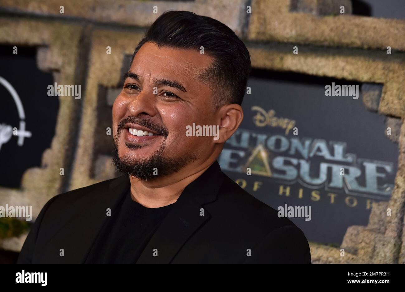 Jacob Vargas arrives at a red carpet event for "National Treasure: Edge ...