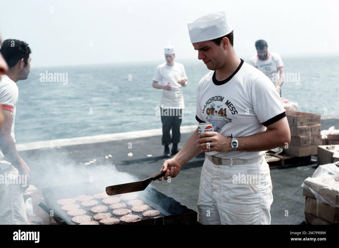 A mess management specialist aboard the aircraft carrier USS MIDWAY (CV ...
