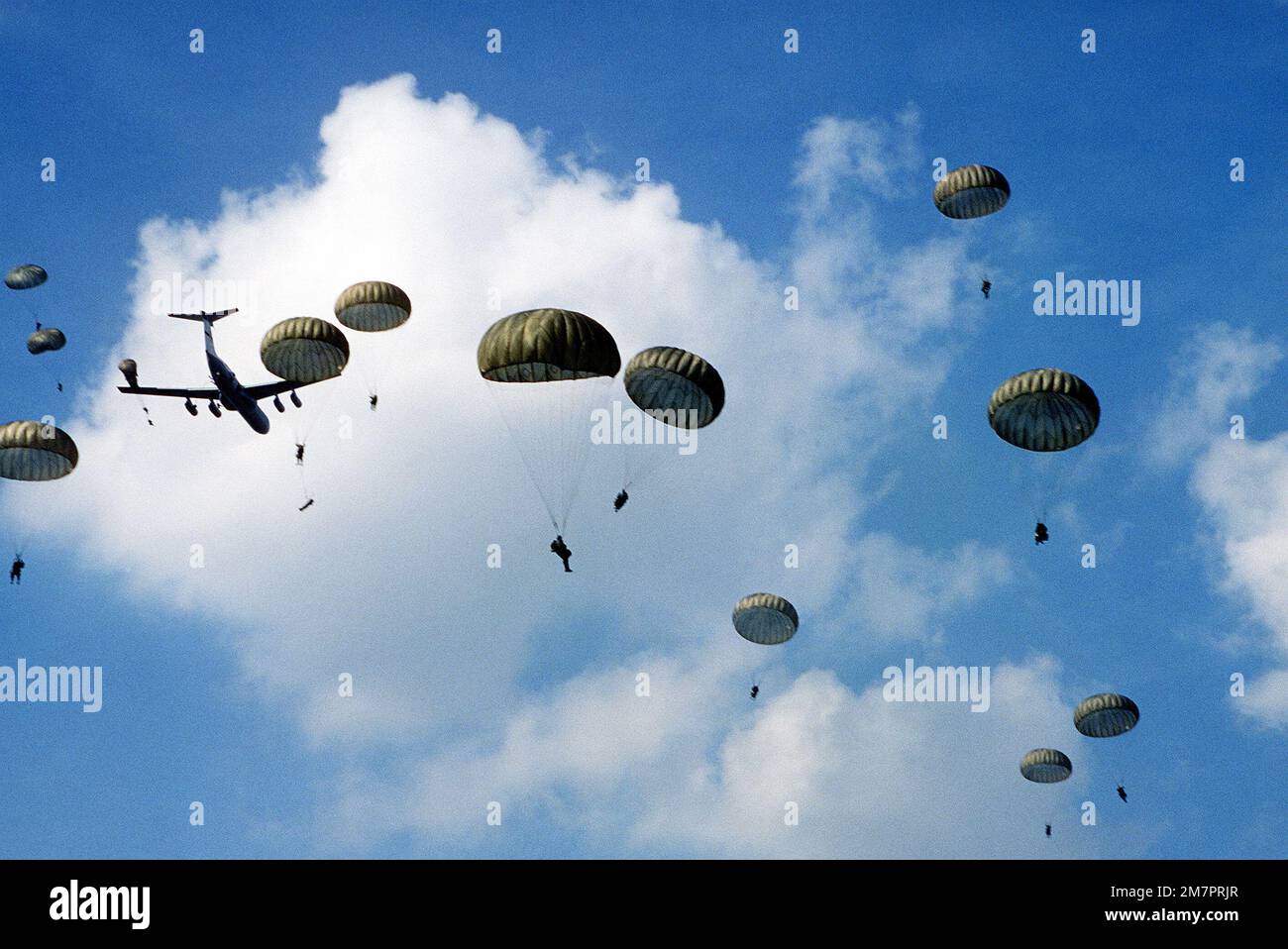 82nd Airborne Division members parachute from a C-141B Starlifter ...