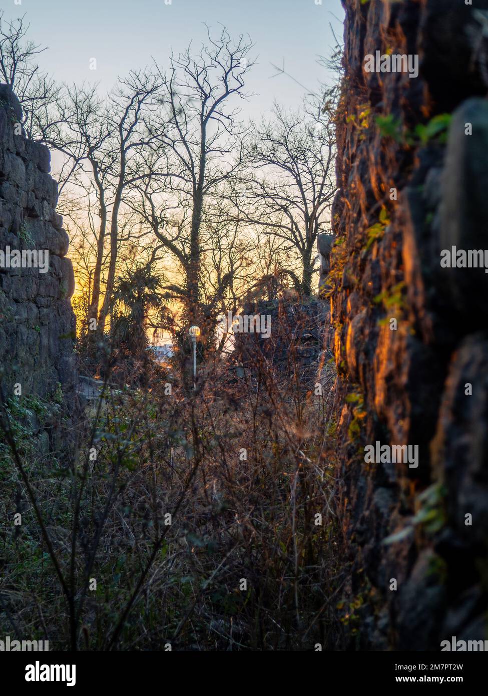 Ancient architecture. In the rays of the setting sun. Remains of an old ...