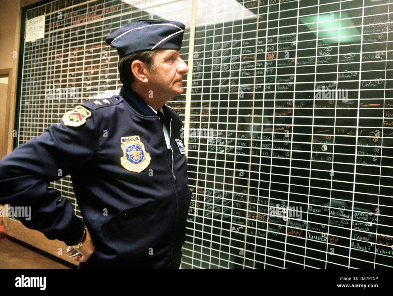 U. S. Air Force MGEN Thomas A. Diab looks at the scheduling board at ...