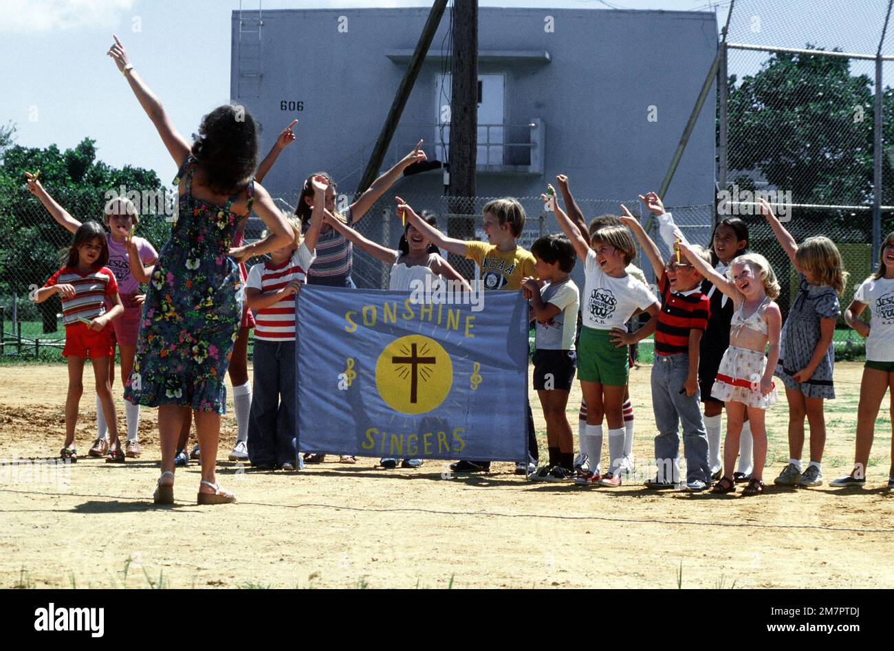 A group of children known as the Sunshine Singers perform at the Rally ...