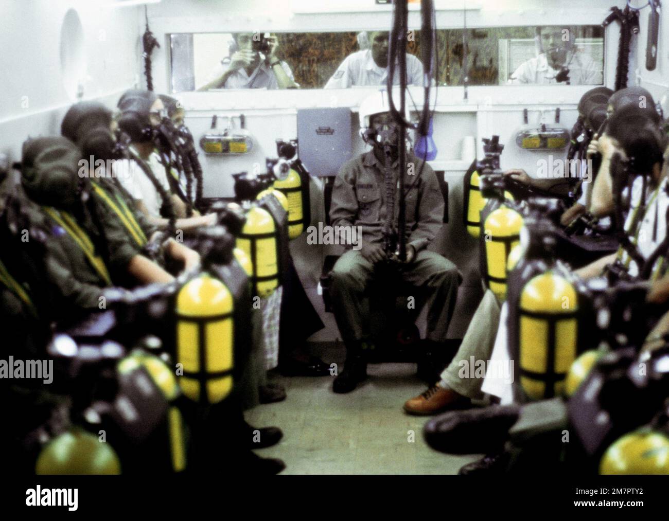 Personnel wearing breathing equipment, are ready for "takeoff" in the ...