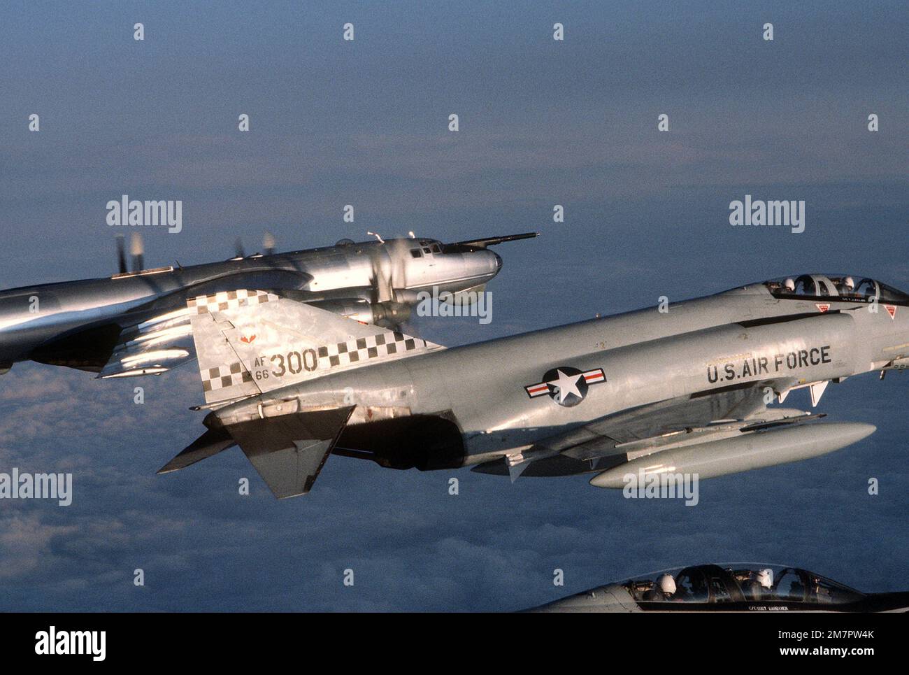 AN air-to-air right side view of two F-4 Phantom II aircraft observing ...