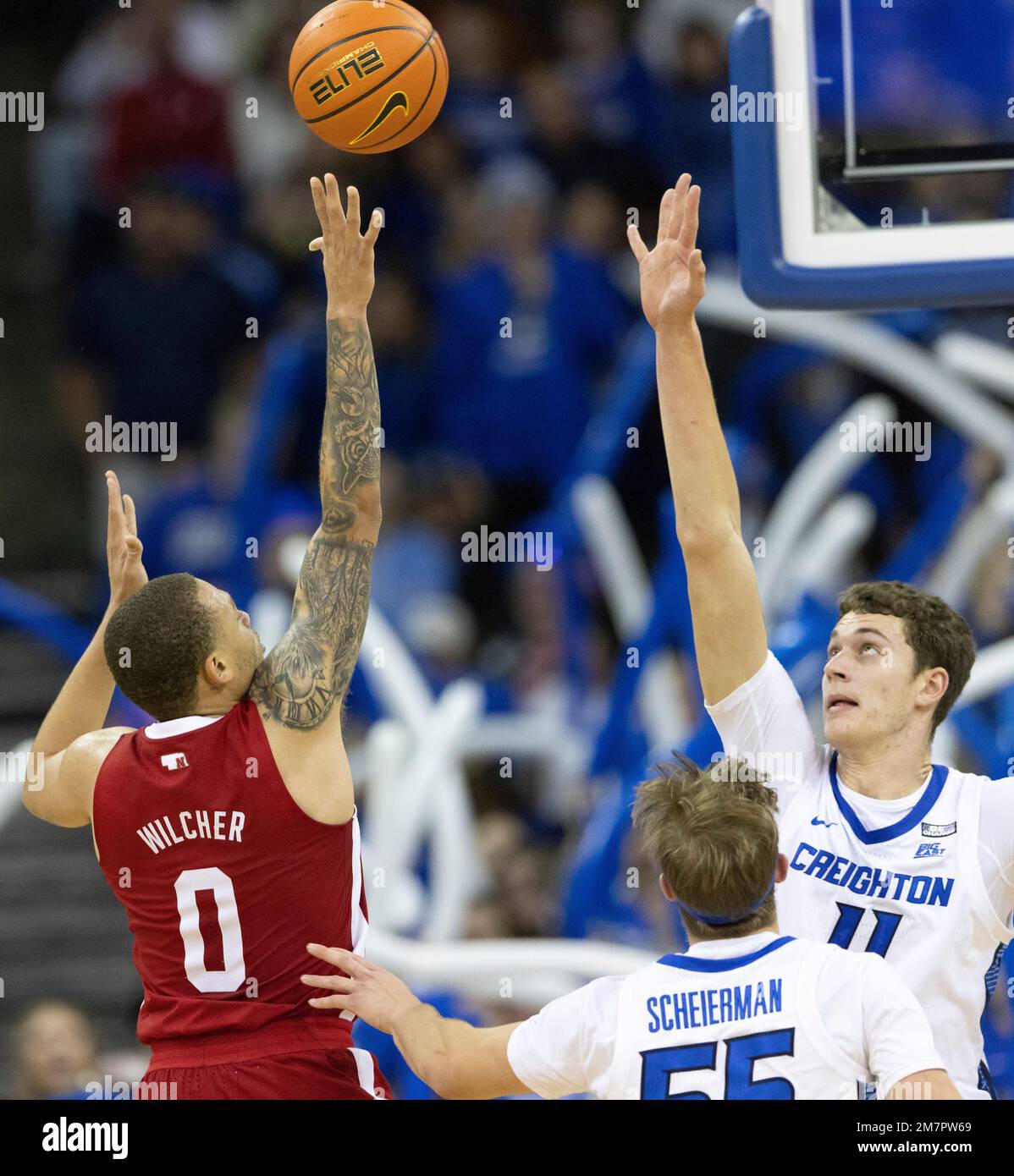 Nebraska's C.J. Wilcher, from left, shoots against Creighton's Baylor ...