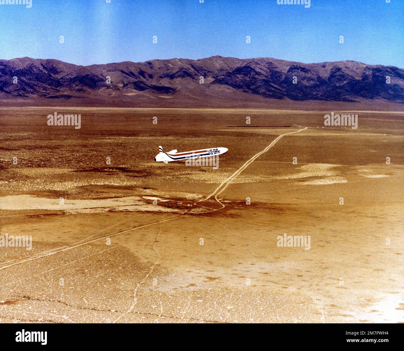 An air-to-air right side view of an air-launched cruise missile in ...