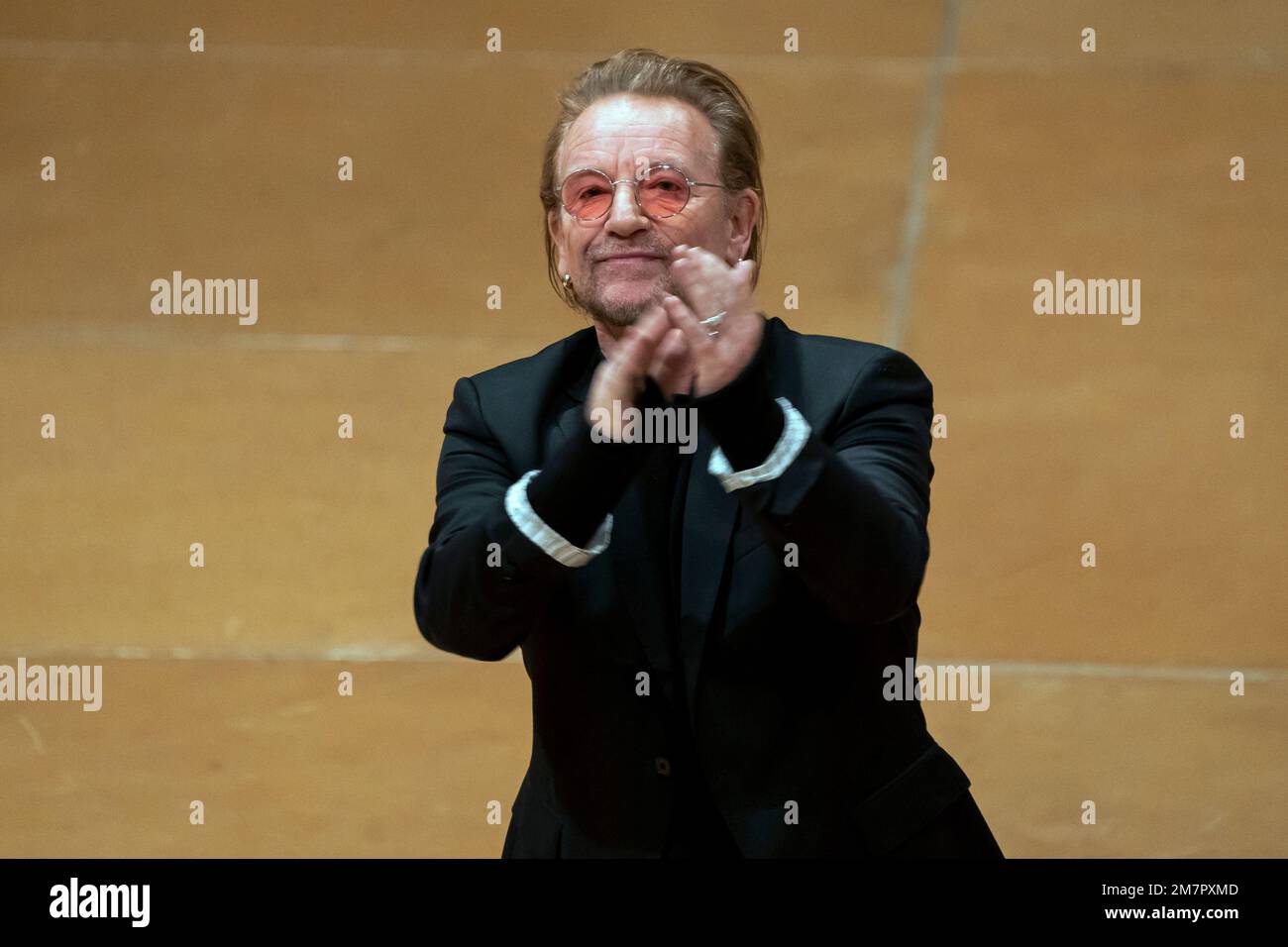 Paul David Hewson, known by his stage name Bono, claps while appearing ...