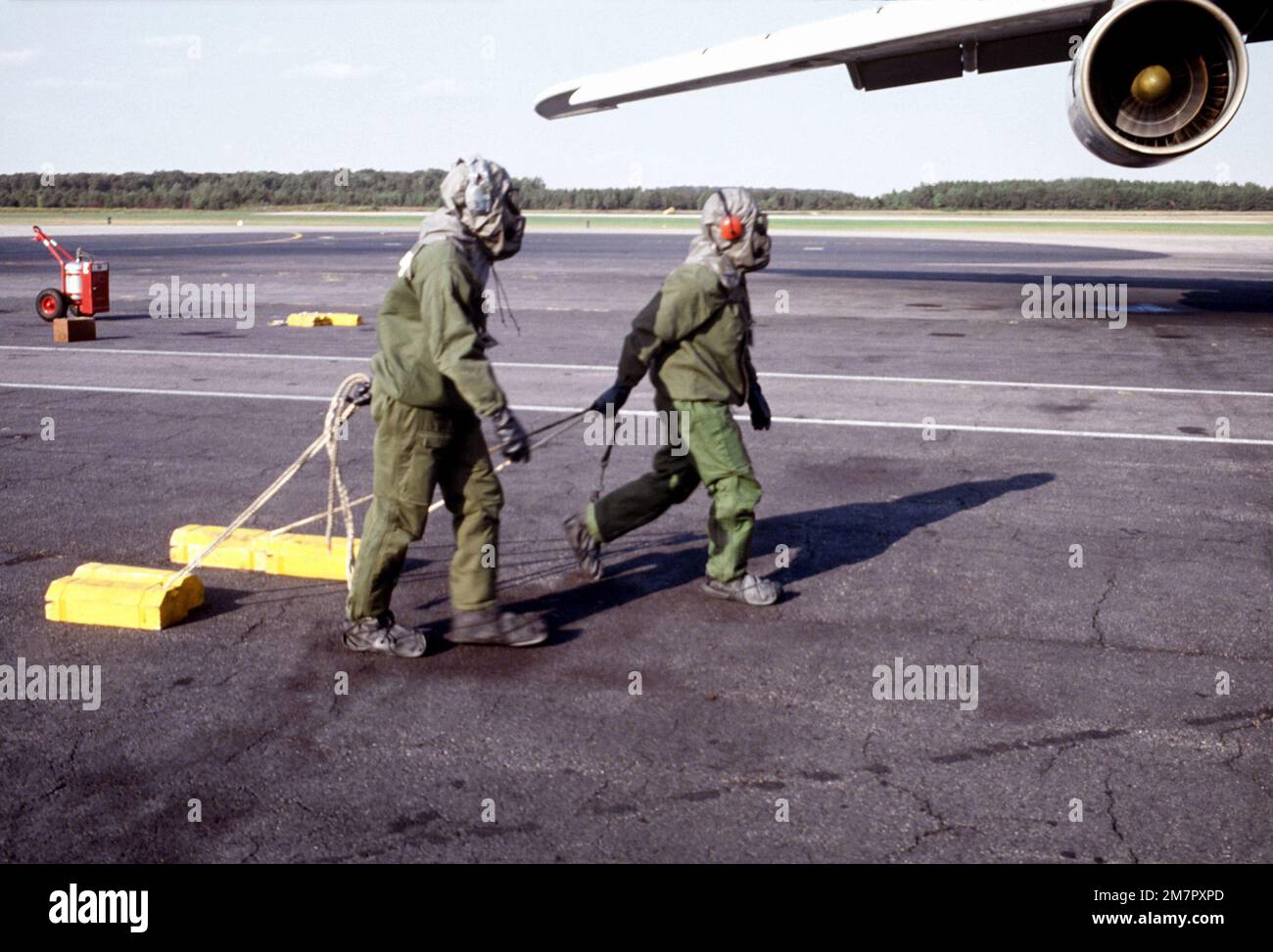 Crew members of the 436th Military Airlift Wing, dressed in chemical ...