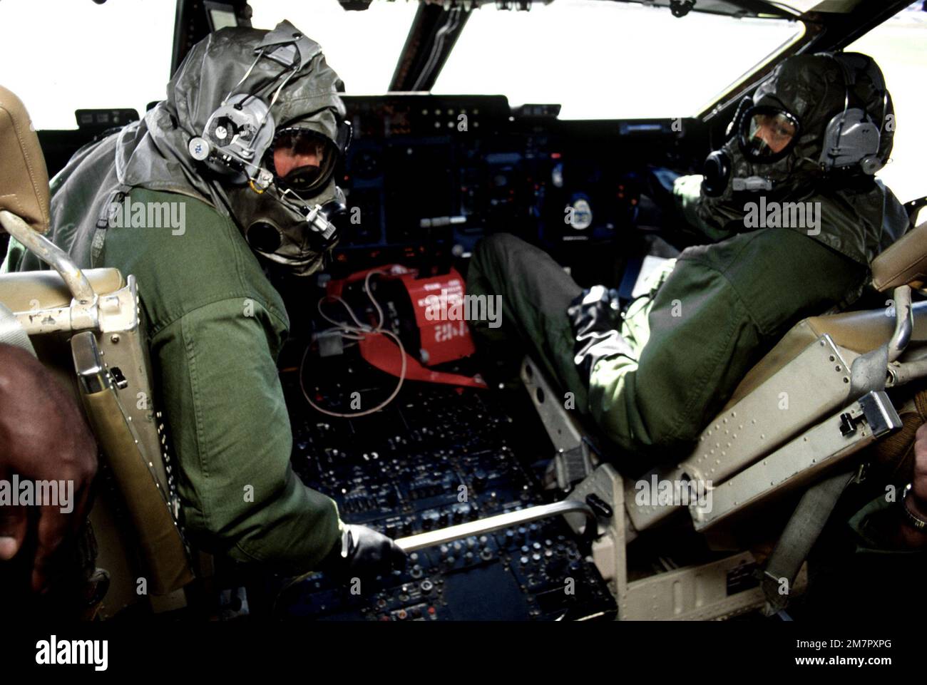 Crew members of the 436th Military Airlift Wing, dressed in chemical ...