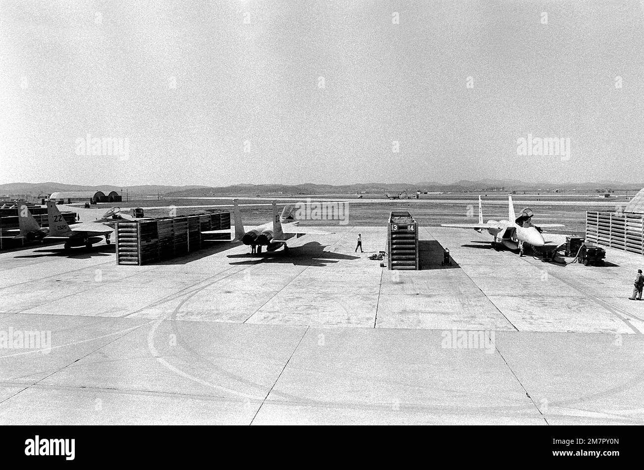 A view of an F-15 Eagle aircraft in a revetment area. Base: Osan Air ...