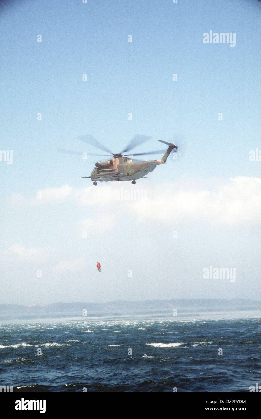 Survivors are picked up by an HH-53 Super Jolly helicopter during ...