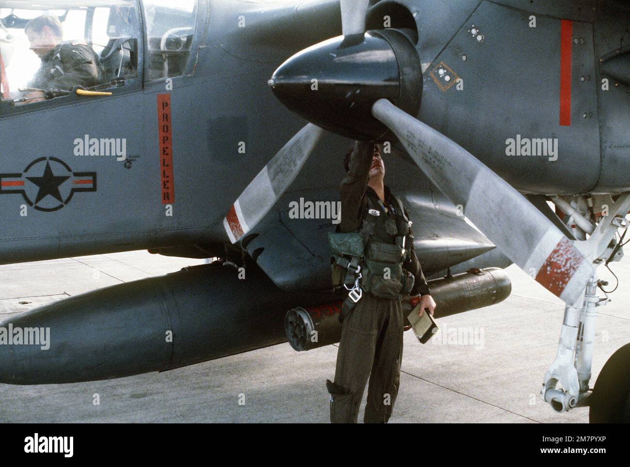 A 19th Tactical Airlift Squadron pilot checks his OV-10A Bronco ...