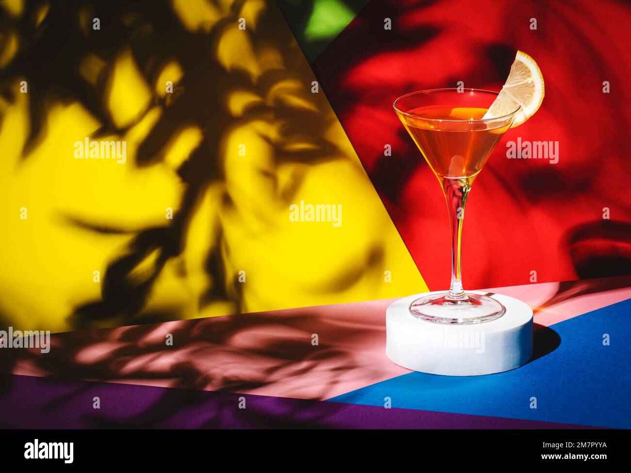 Yellow bird alcoholic cocktail with white rum, liquor and lime juice in ...