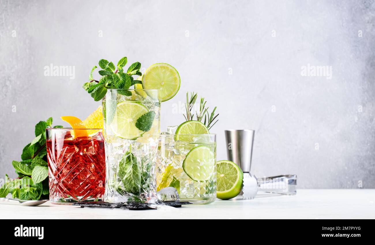 Most popular alcoholic cocktails set: mojito, gin tonic and negroni on ...