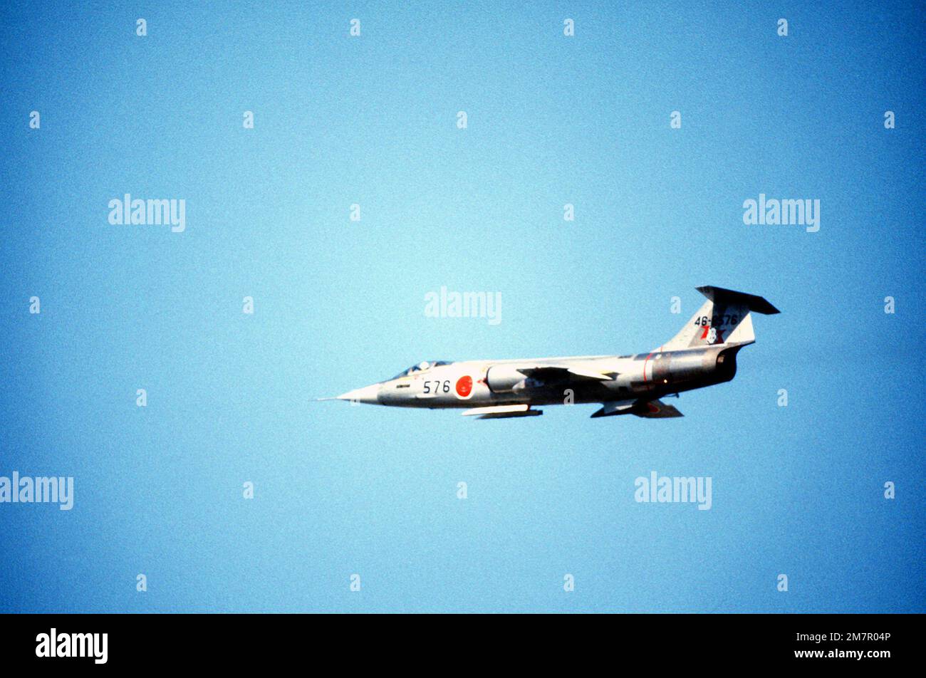 AN air-to-air left side view of Japanese Air Self Defense Force F-104 ...