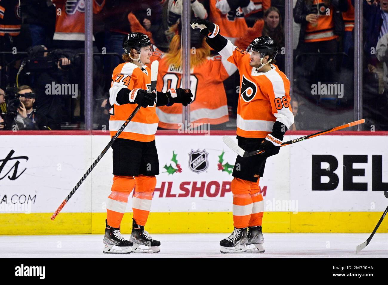 Philadelphia Flyers' Owen Tippett, left, celebrates his goal with Joel ...