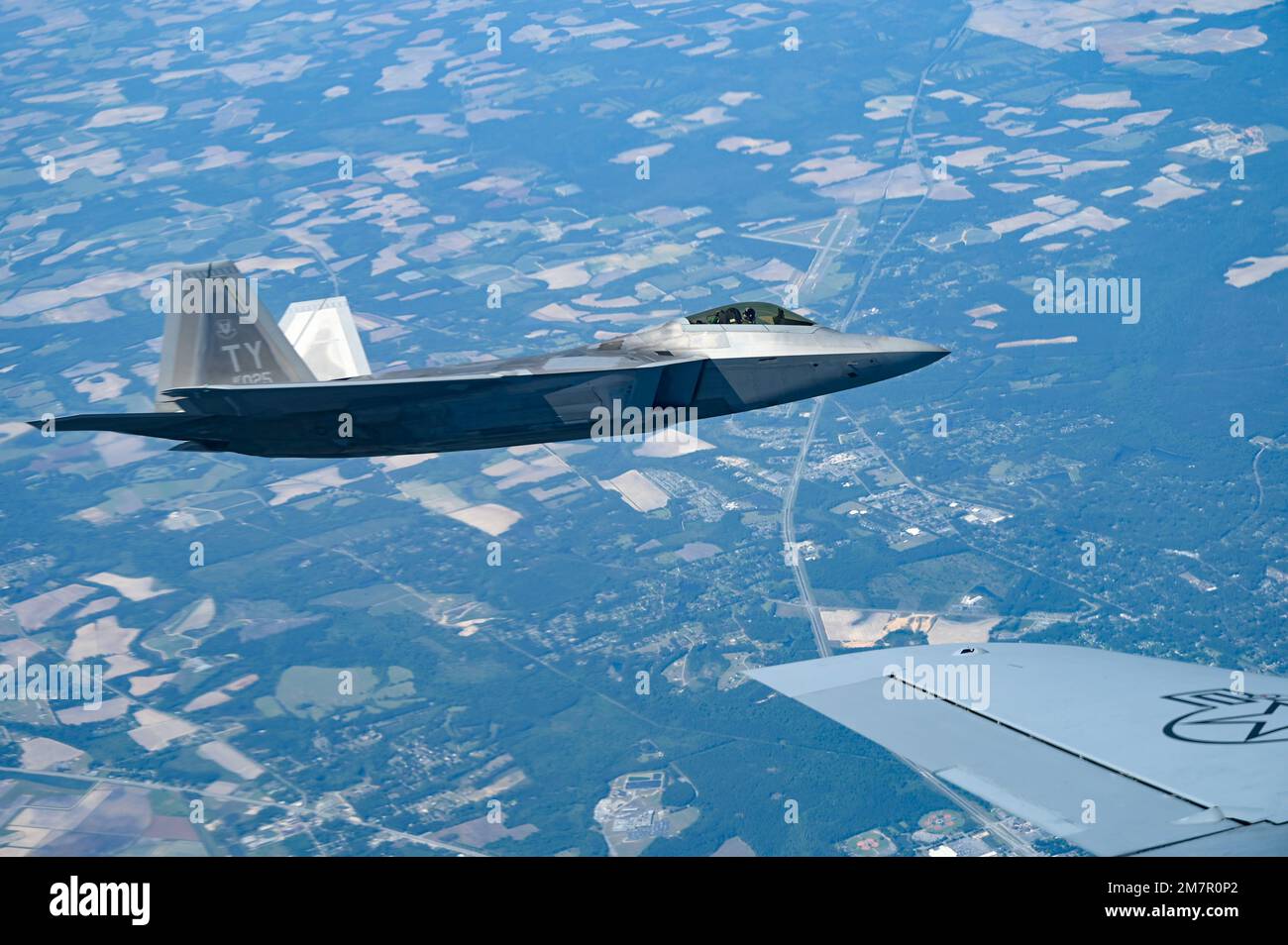 A U.S. Air Force F-22 Raptor with the 325th Fighter Wing, approaches a ...