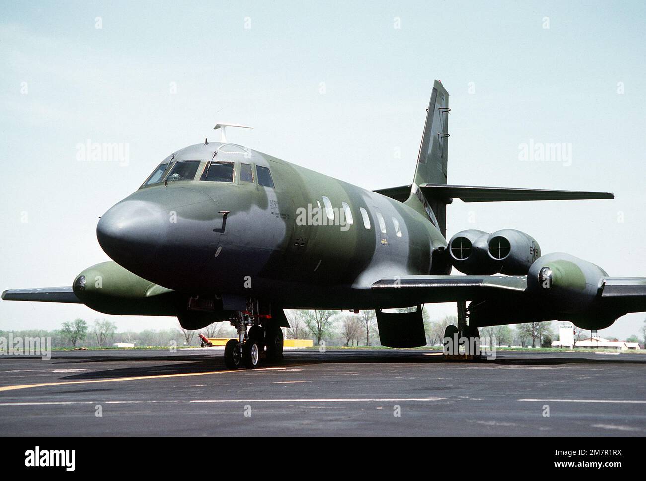 A left front view of a C-140 Jet Star aircraft just before taxiing away ...