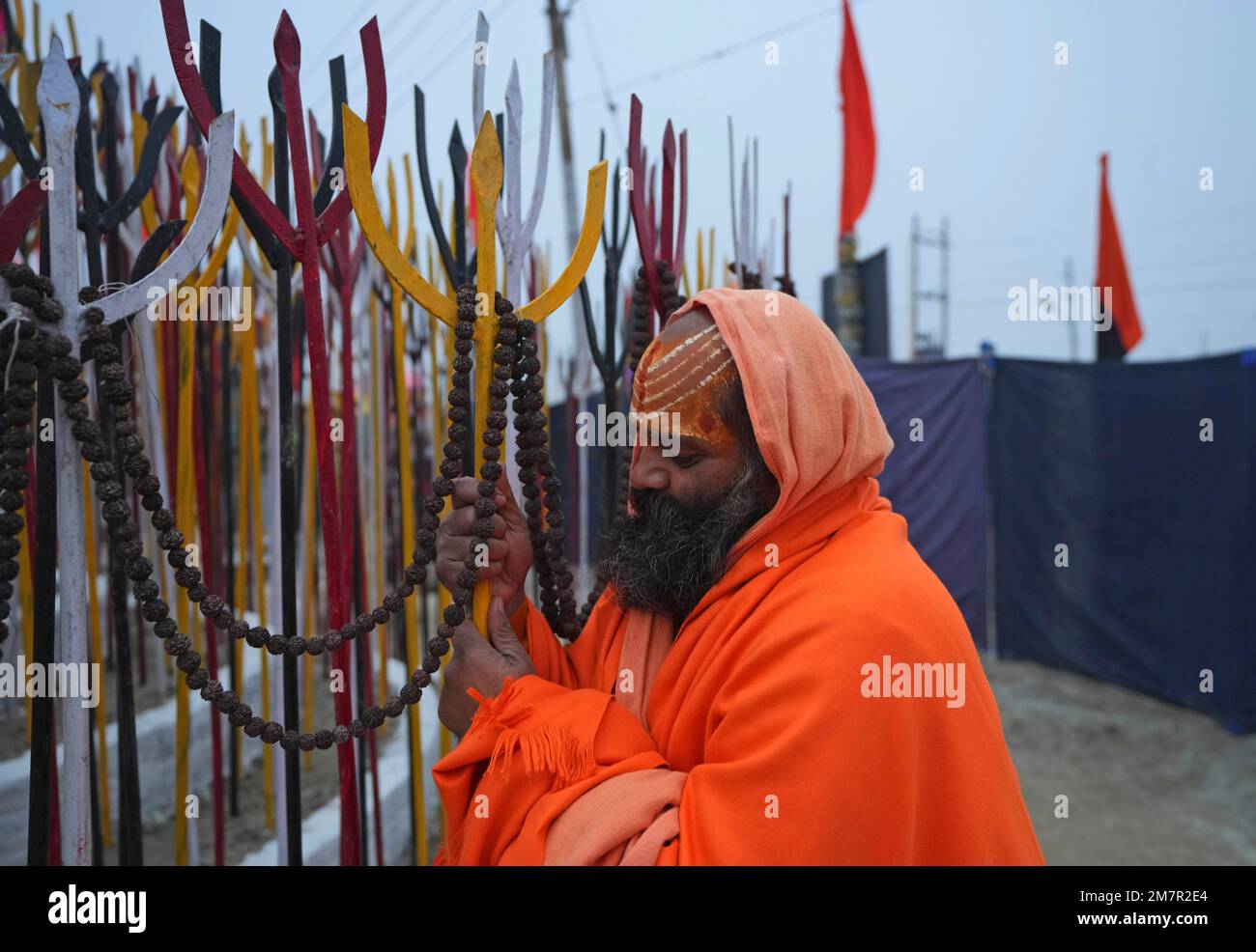 Mauni Baba, a Hindu holy man, prepares an area for the month-long Magh ...