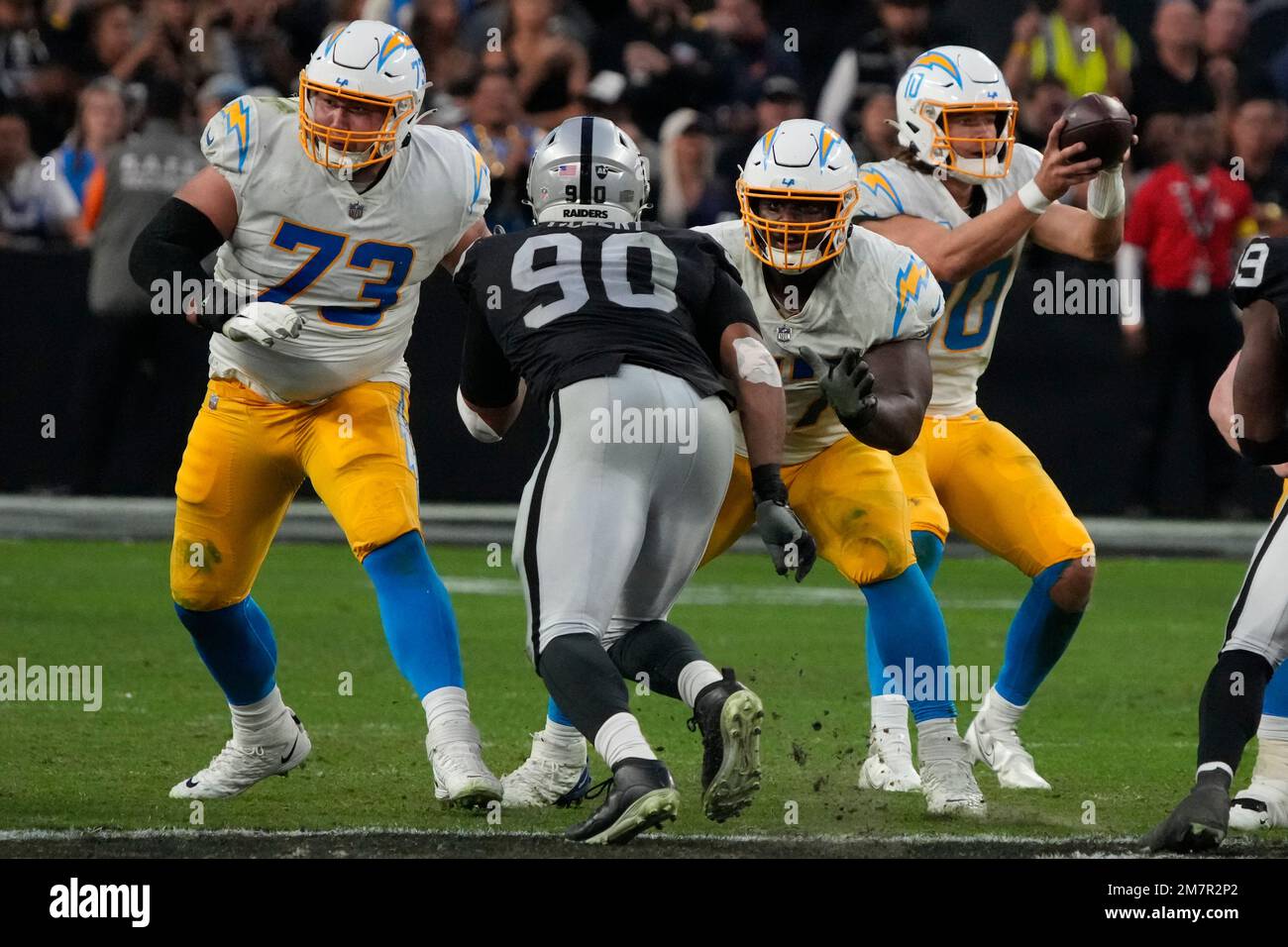 Los Angeles Chargers guard Zion Johnson (77) lines up against the Las ...