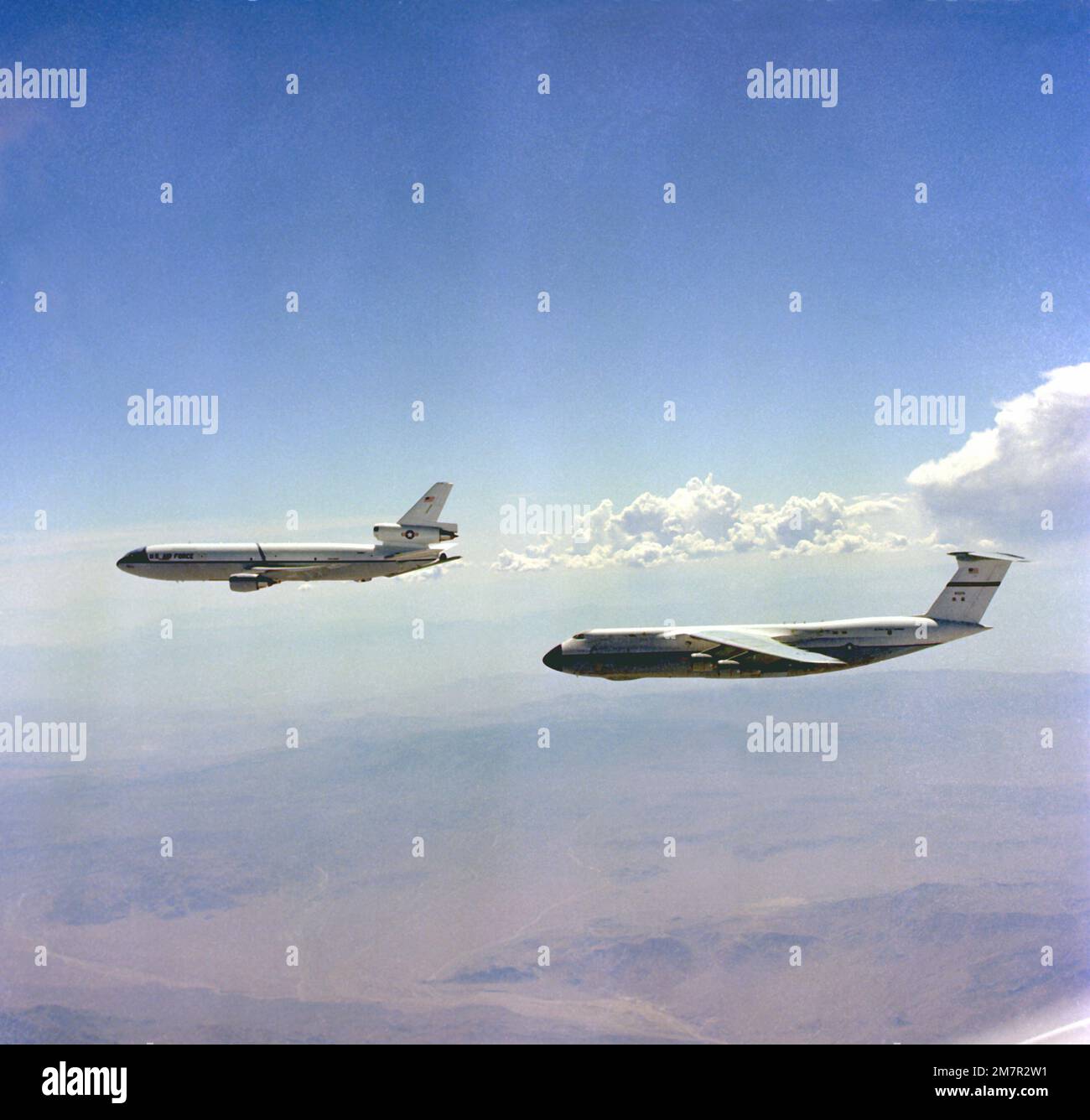 AN air-to-air left side view of a KC-10A Extender aircraft, left, with ...