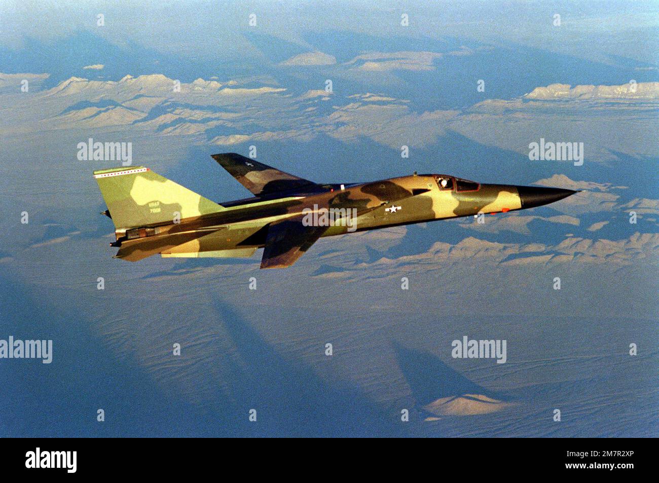 A right side view of an F-111 aircraft during testing of B-83 nuclear ...