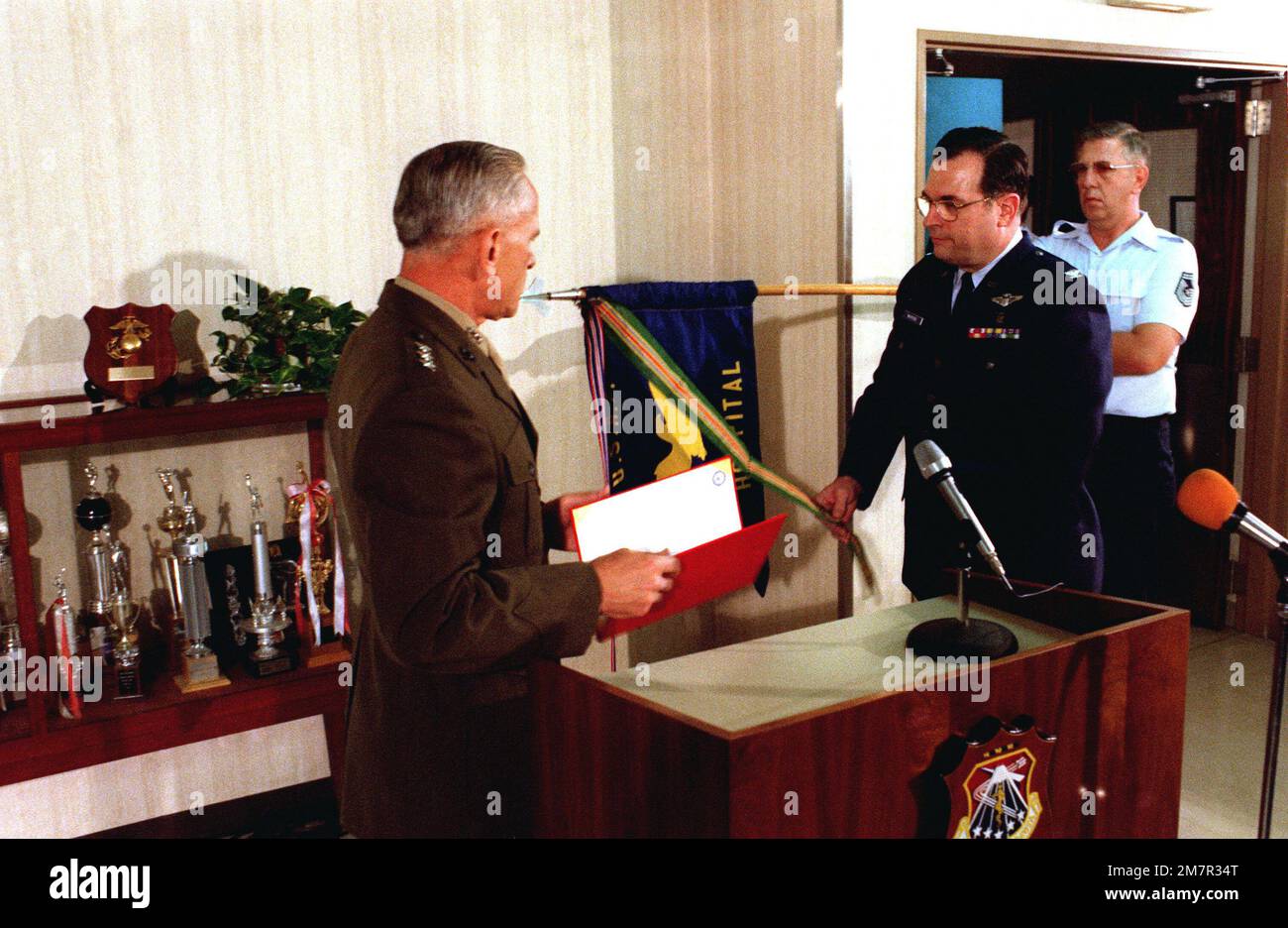Lieutenant General Edward Bronars, left, presents the Meritorious Unit ...