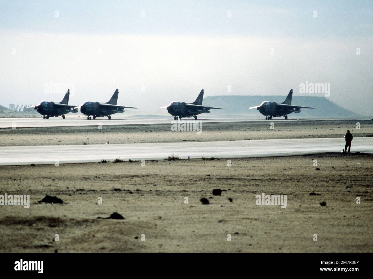 A left front view of four A-7 Corsair II aircraft preparing for take ...