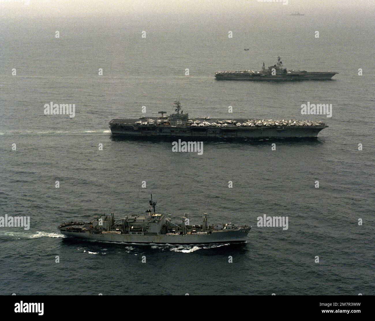 An aerial starboard beam view, from front to back, of the combat stores ...