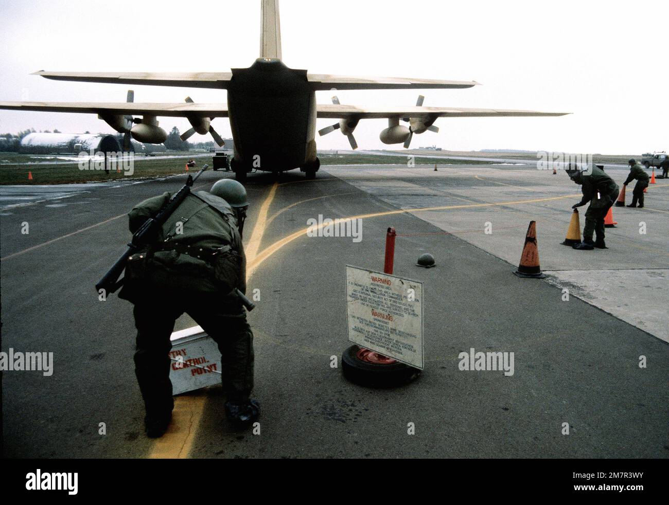 Members of the 50th Tactical Fighter Wing dressed in chemical warfare ...