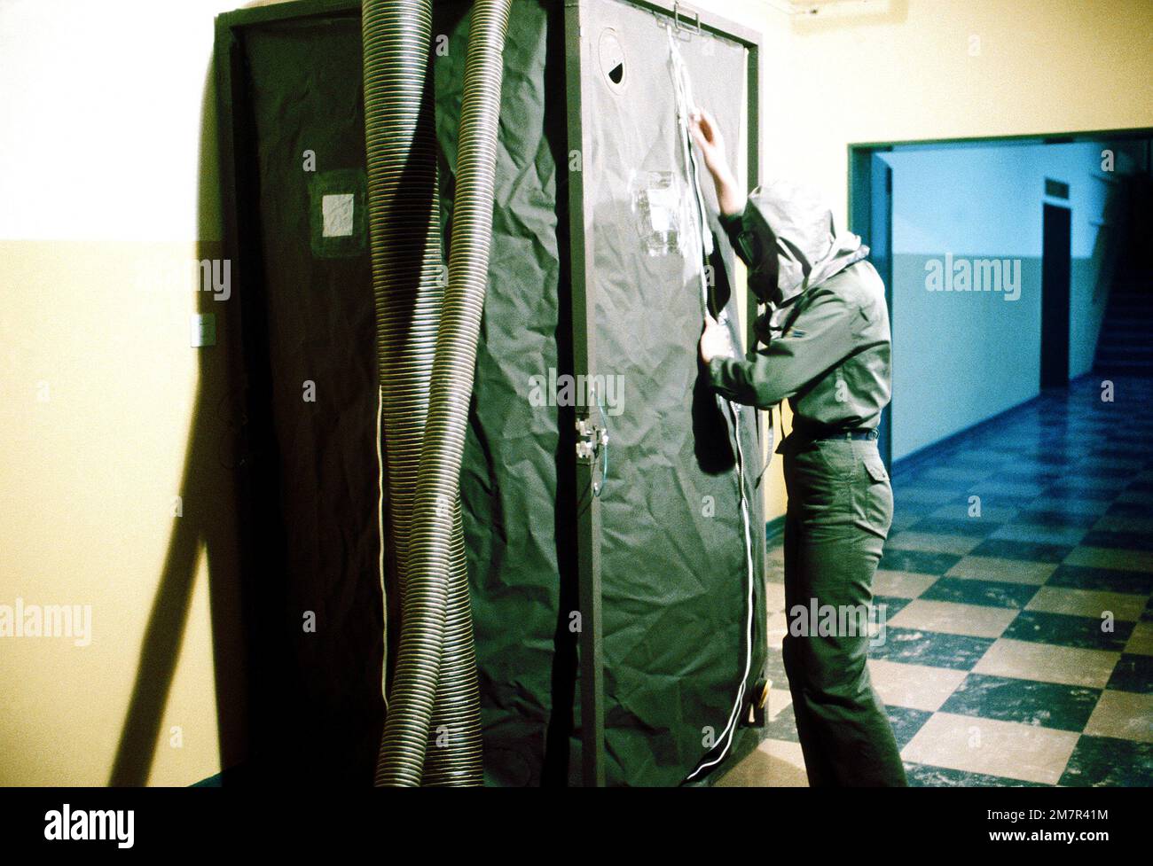 A member of the 50th Civil Engineering Squadron dressed in chemical ...