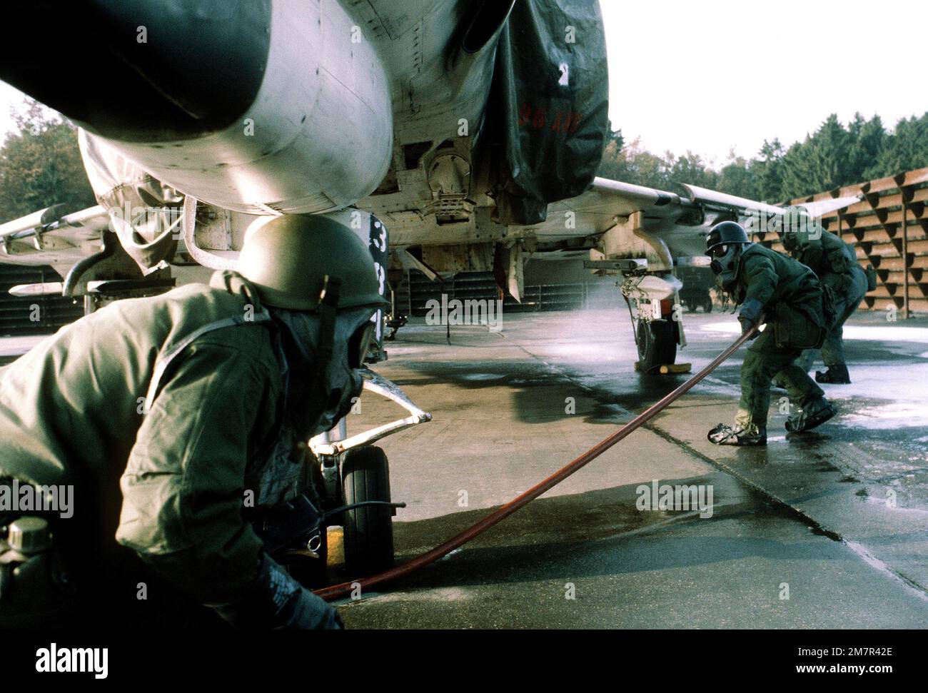 A disaster preparedness team dressed in chemical warfare gear performs ...