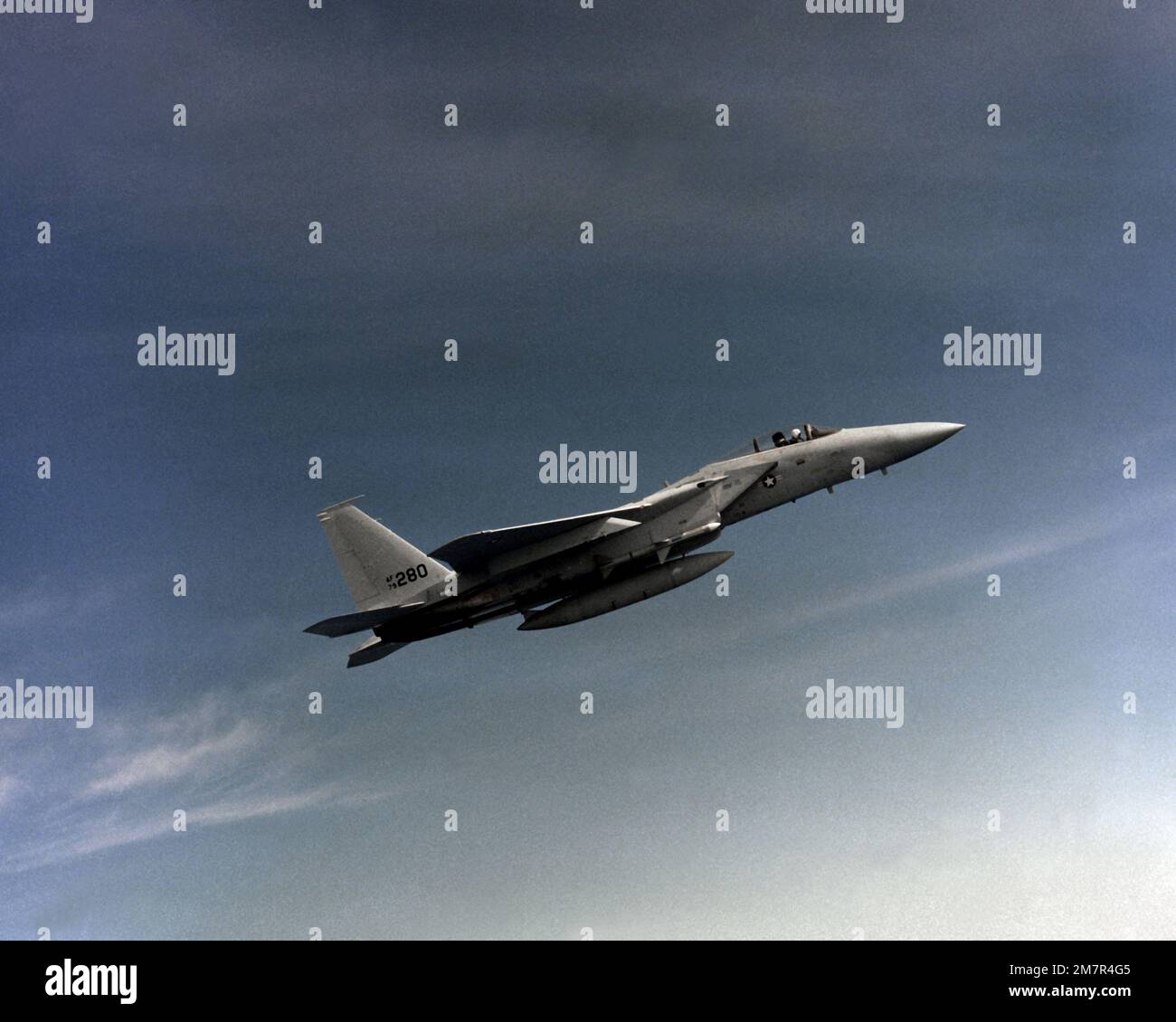 An air-to-air right side view of an F-15J Eagle aircraft with an AIM-7F ...
