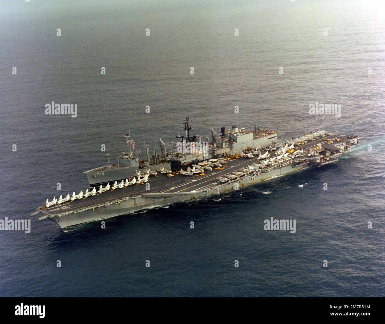 An aerial port bow view of the aircraft carrier USS MIDWAY (CV 41) and ...