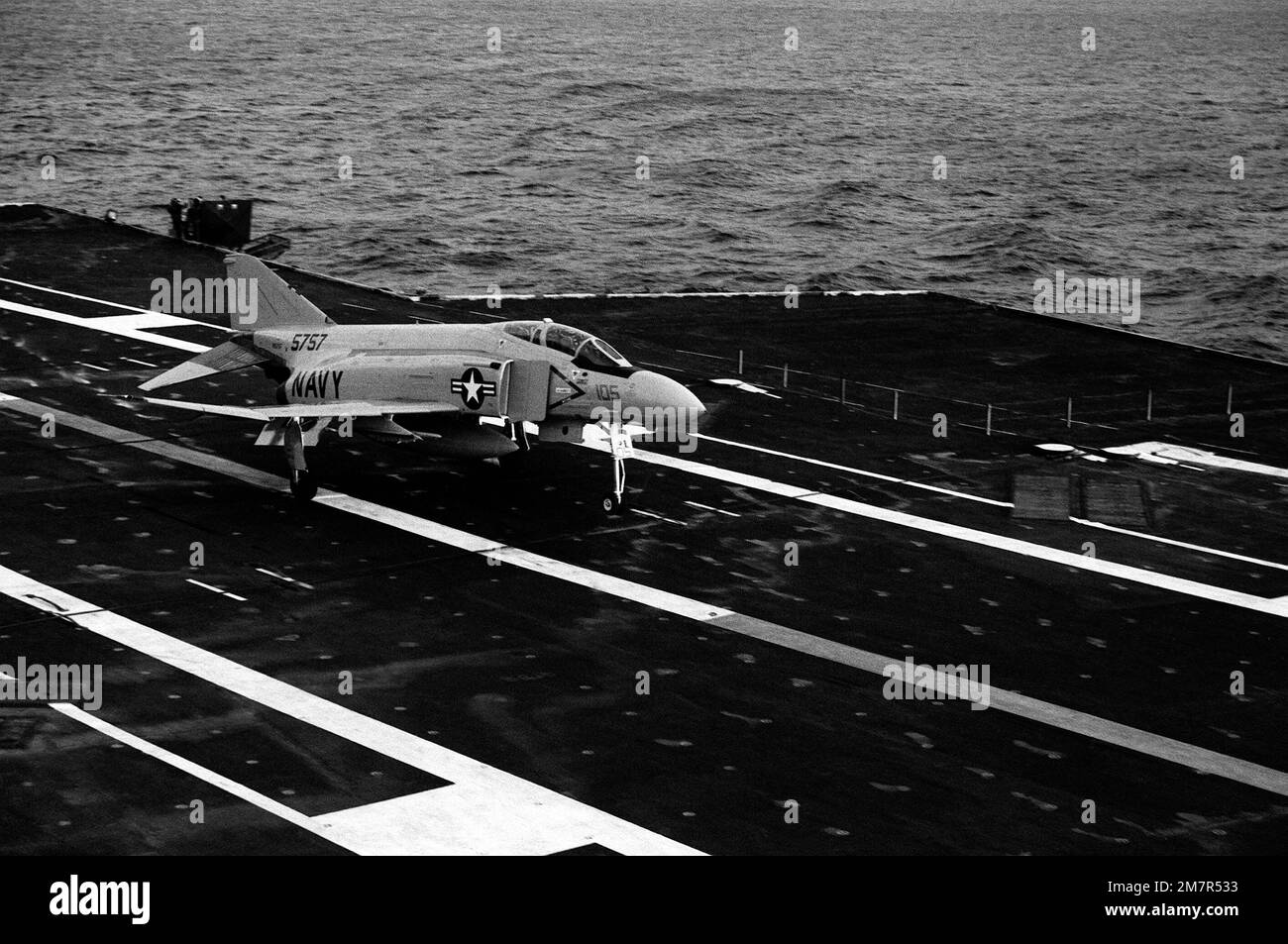 A right front view of the first landing of an F-4A Phantom II aircraft ...