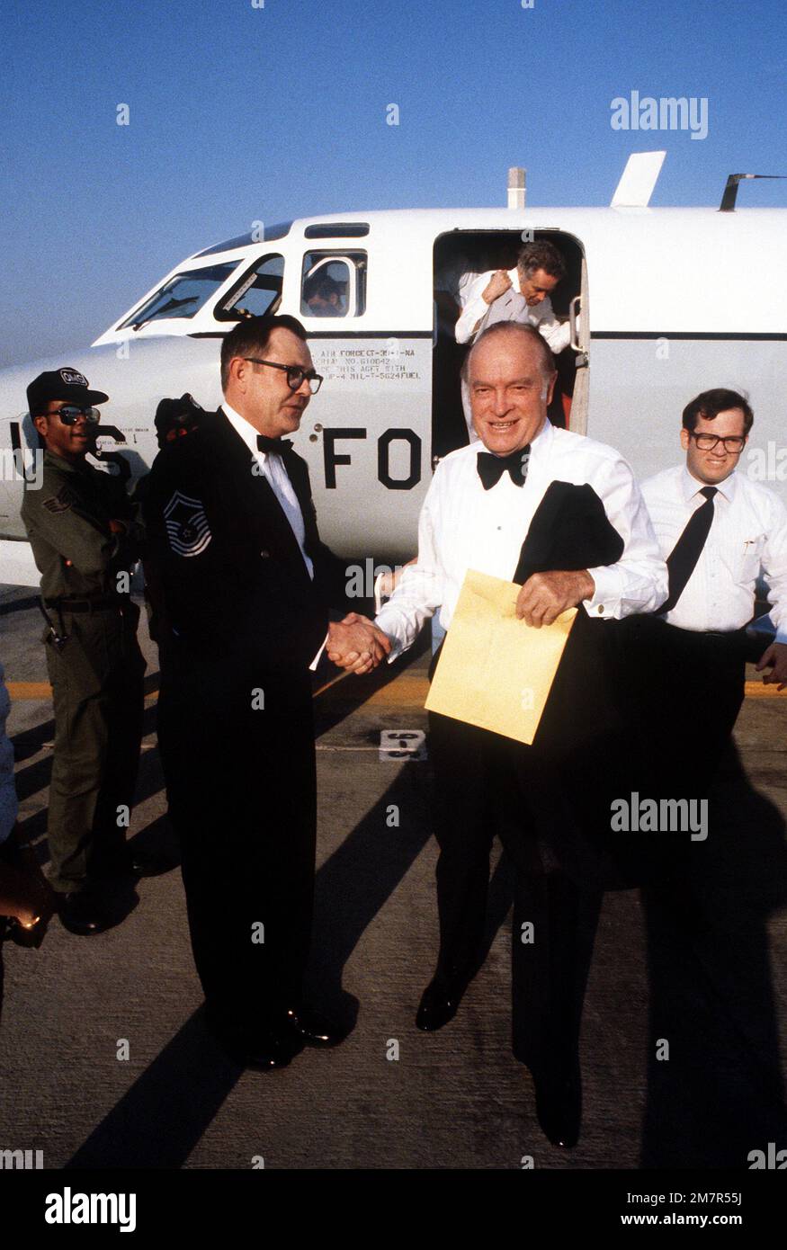 CHIEF MASTER SGT. Tom Feeney greets entertainer Bob Hope as he arrives ...